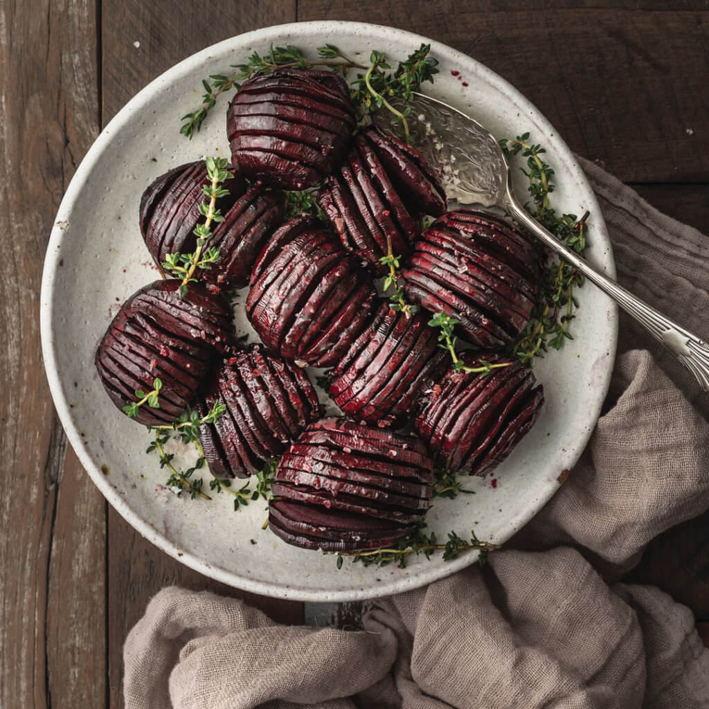 Hasselback beetroot with thyme and maple | Nourish plant-based living