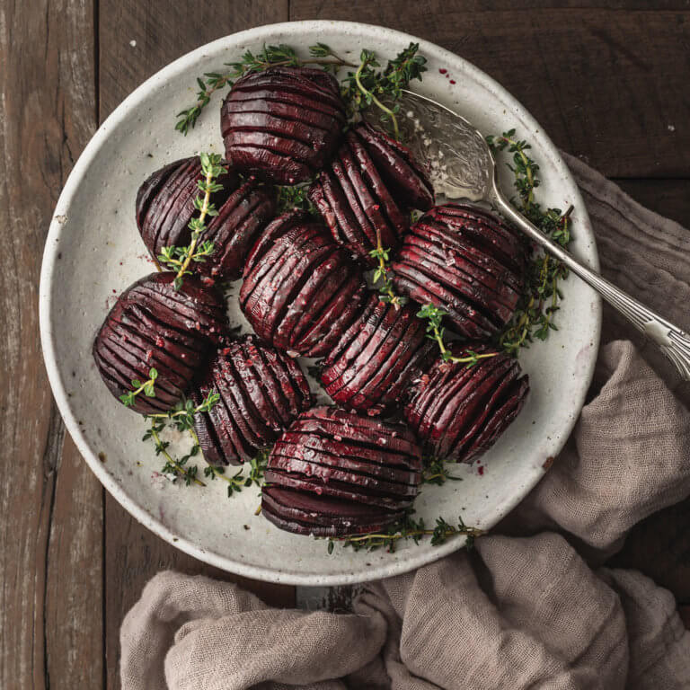 Hasselback beetroot with thyme and maple | Nourish plant-based living